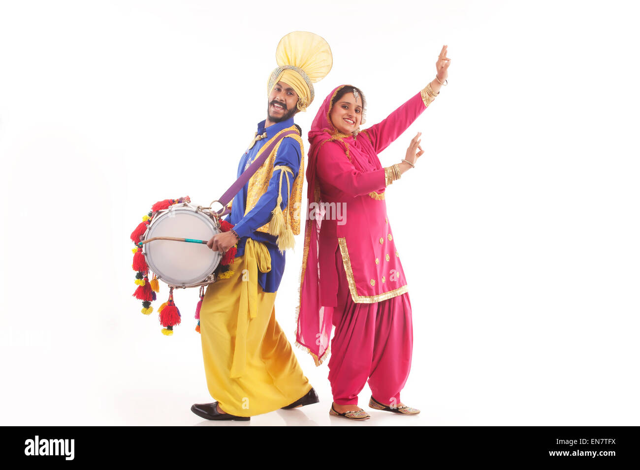 Portrait of Sikh couple doing bhangra dance Stock Photo - Alamy