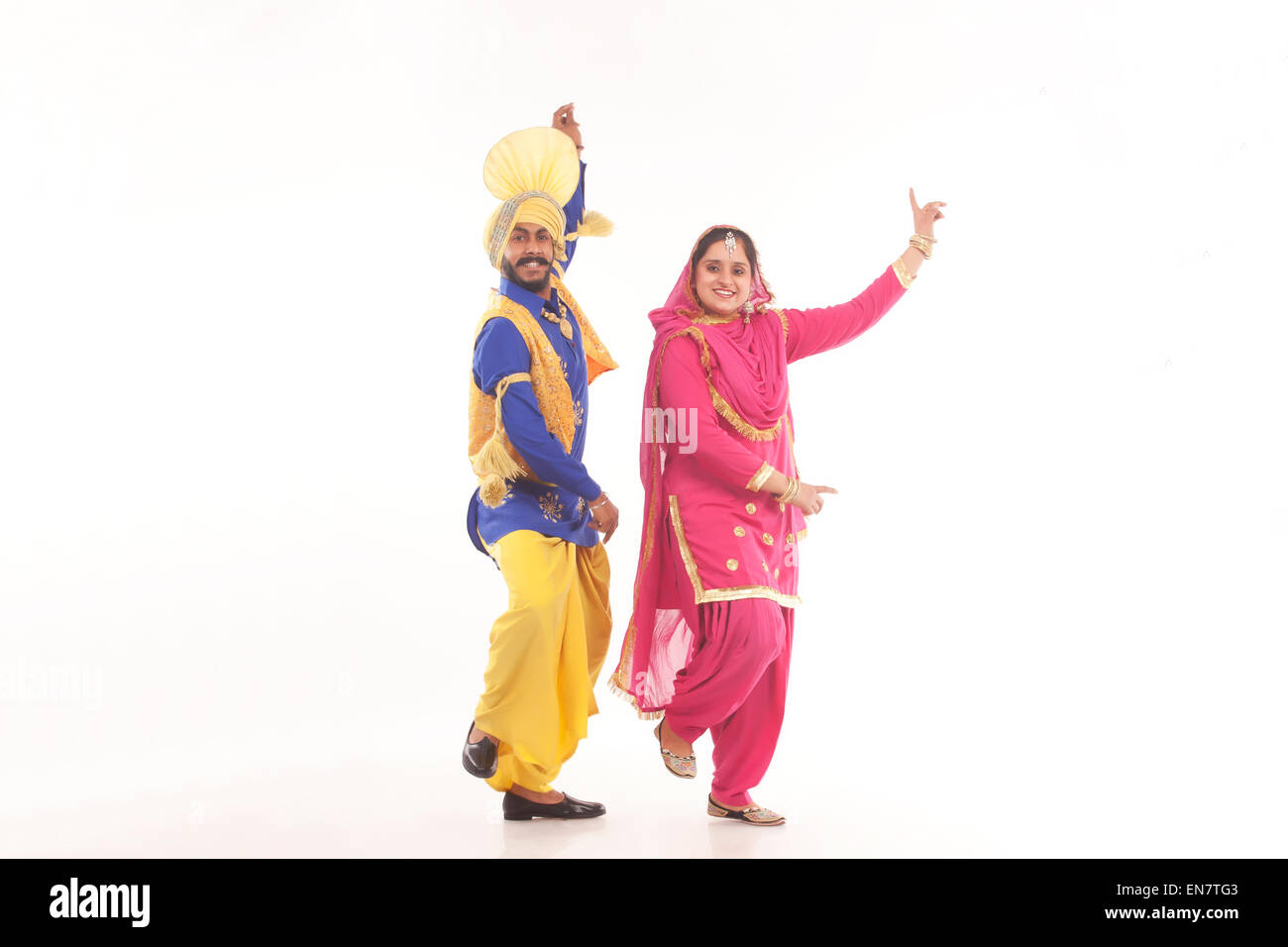 Portrait of Sikh couple doing bhangra dance Stock Photo - Alamy