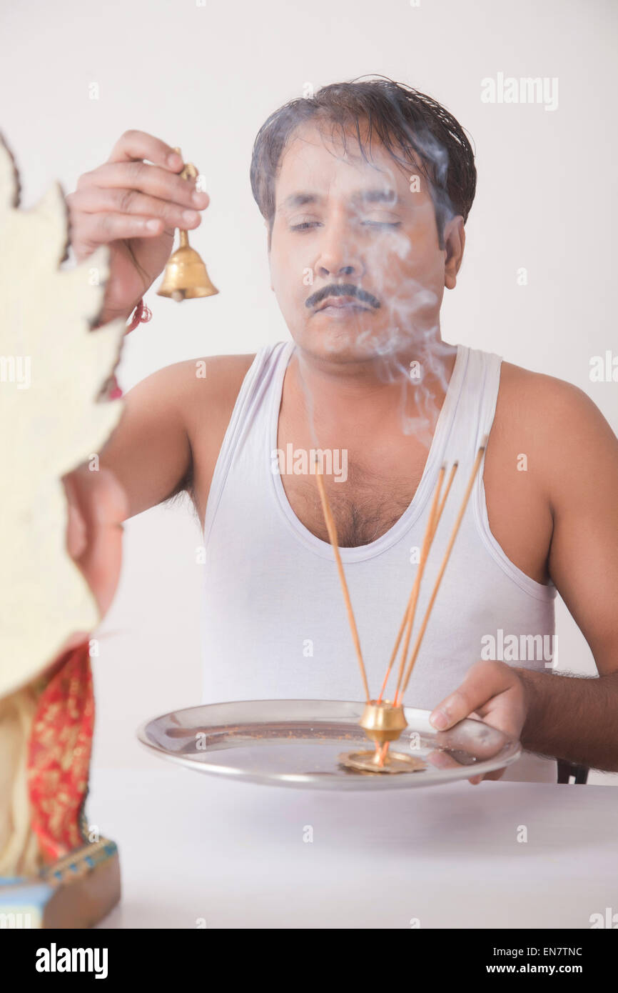 Man performing a pooja Stock Photo - Alamy