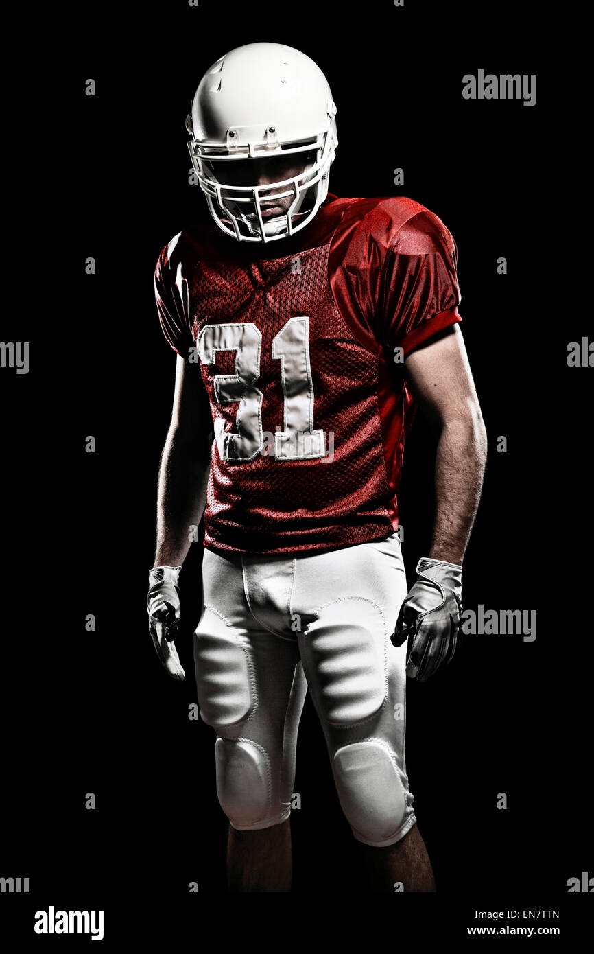 Football Player with number on a red uniform. Studio shot Stock Photo ...