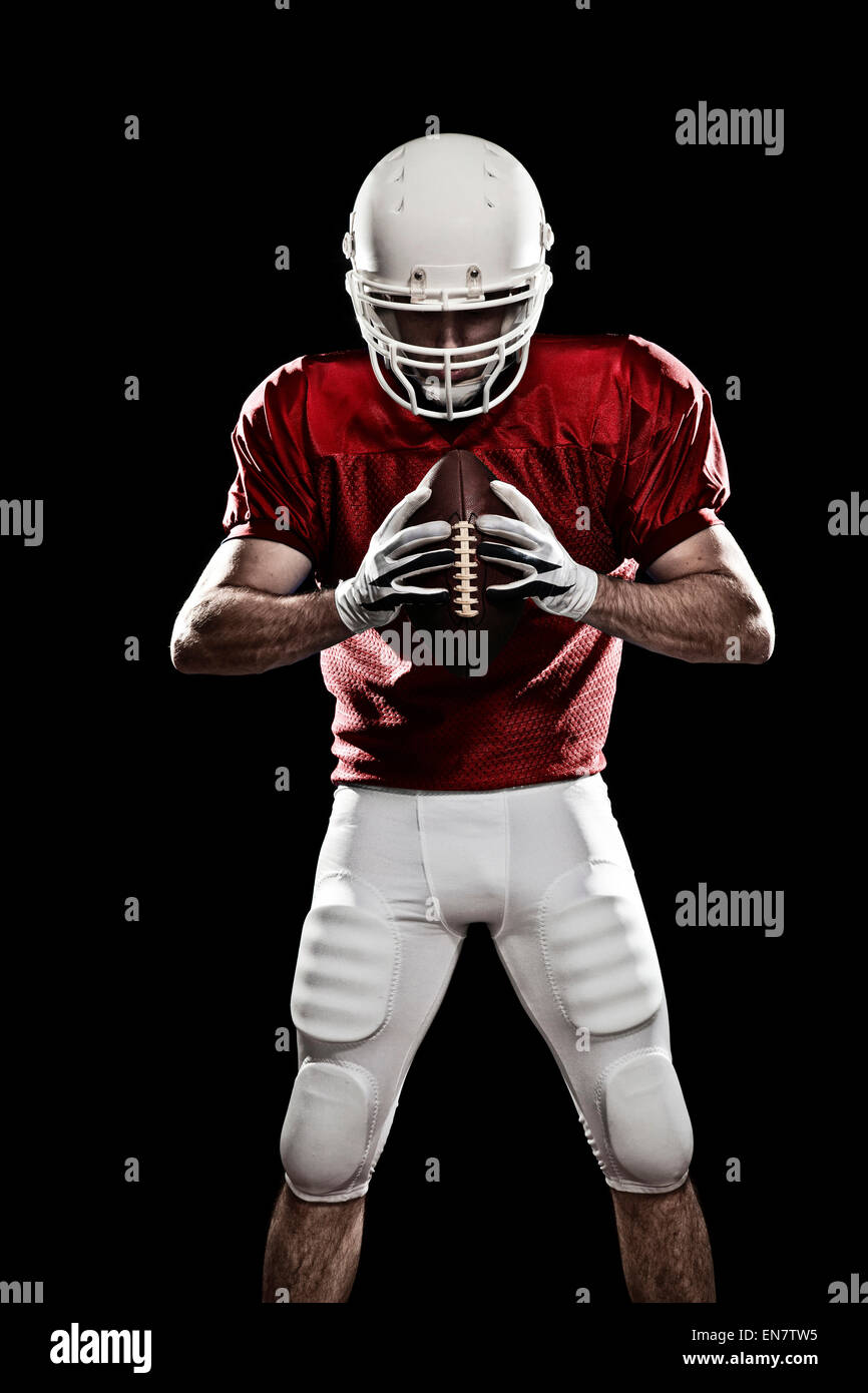 Football Player with number on a red uniform. Studio shot Stock Photo ...