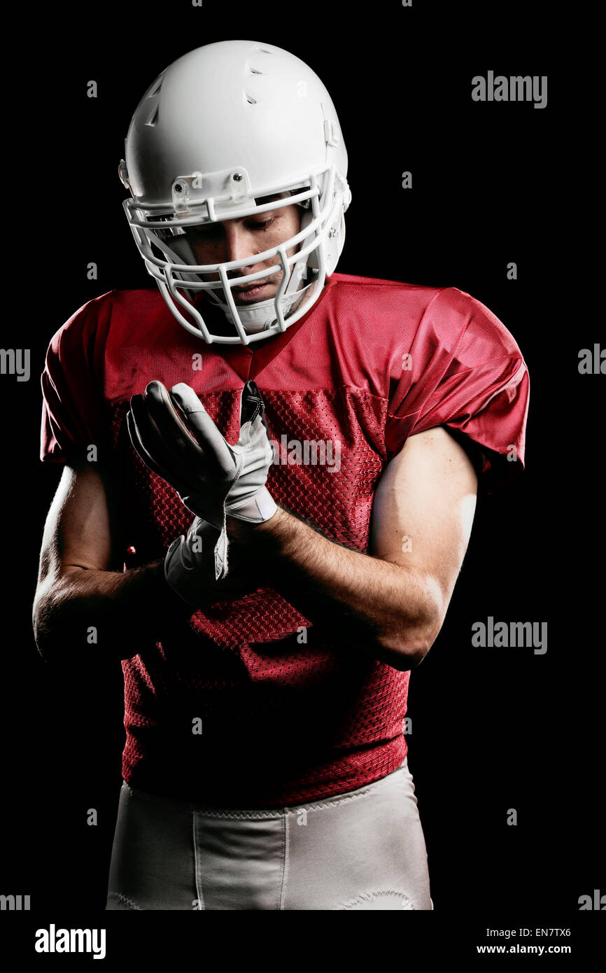 Football Player with number on a red uniform. Studio shot Stock Photo ...