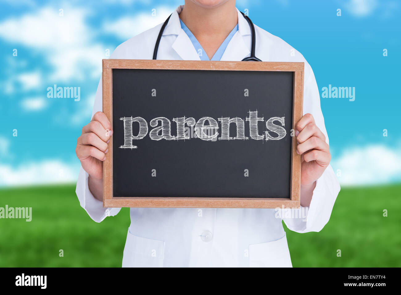 Parents against field and sky Stock Photo - Alamy