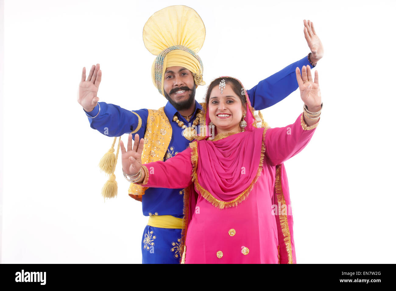 Portrait of Sikh couple doing bhangra dance Stock Photo - Alamy