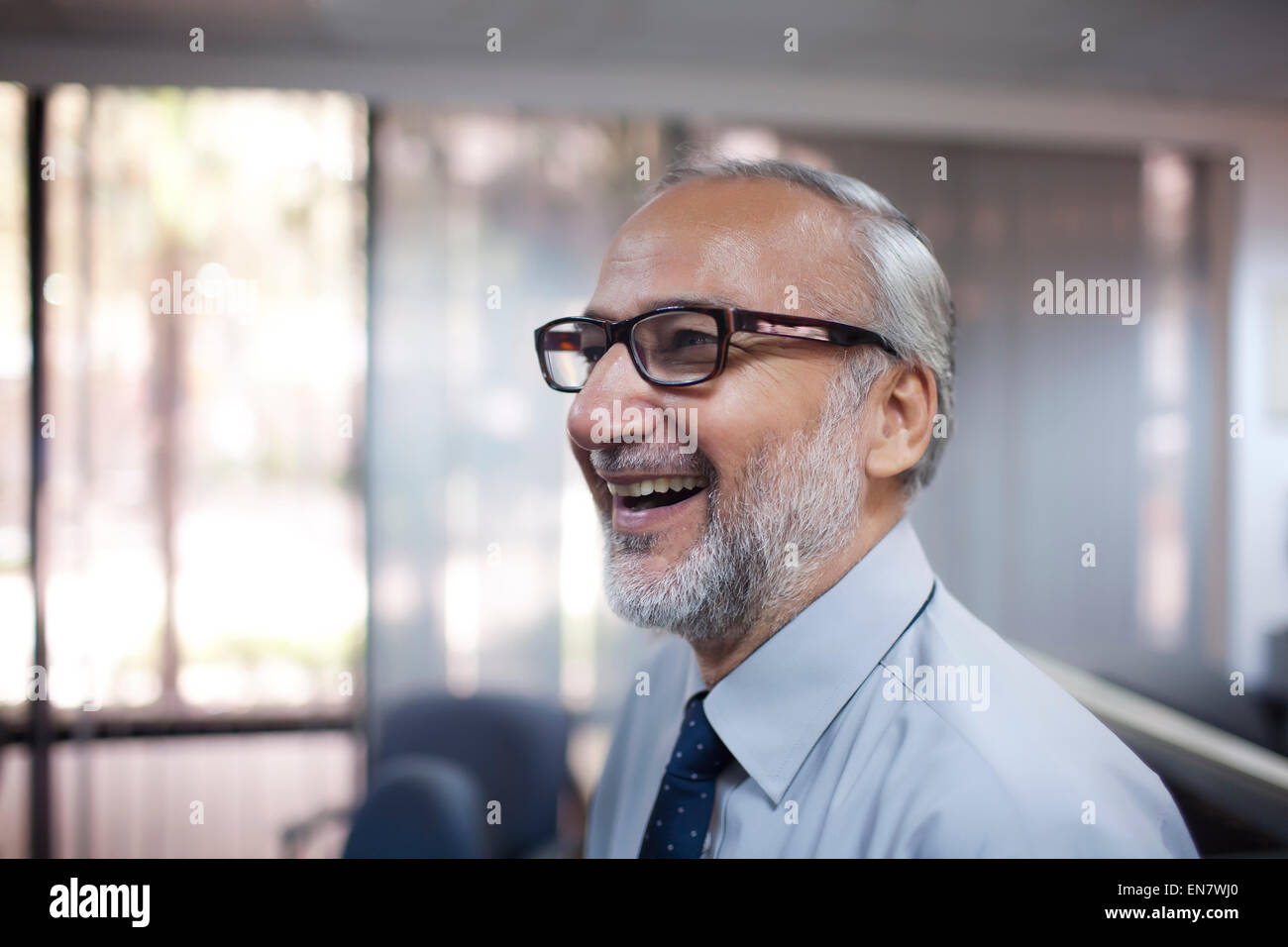 Senior executive smiling Stock Photo - Alamy