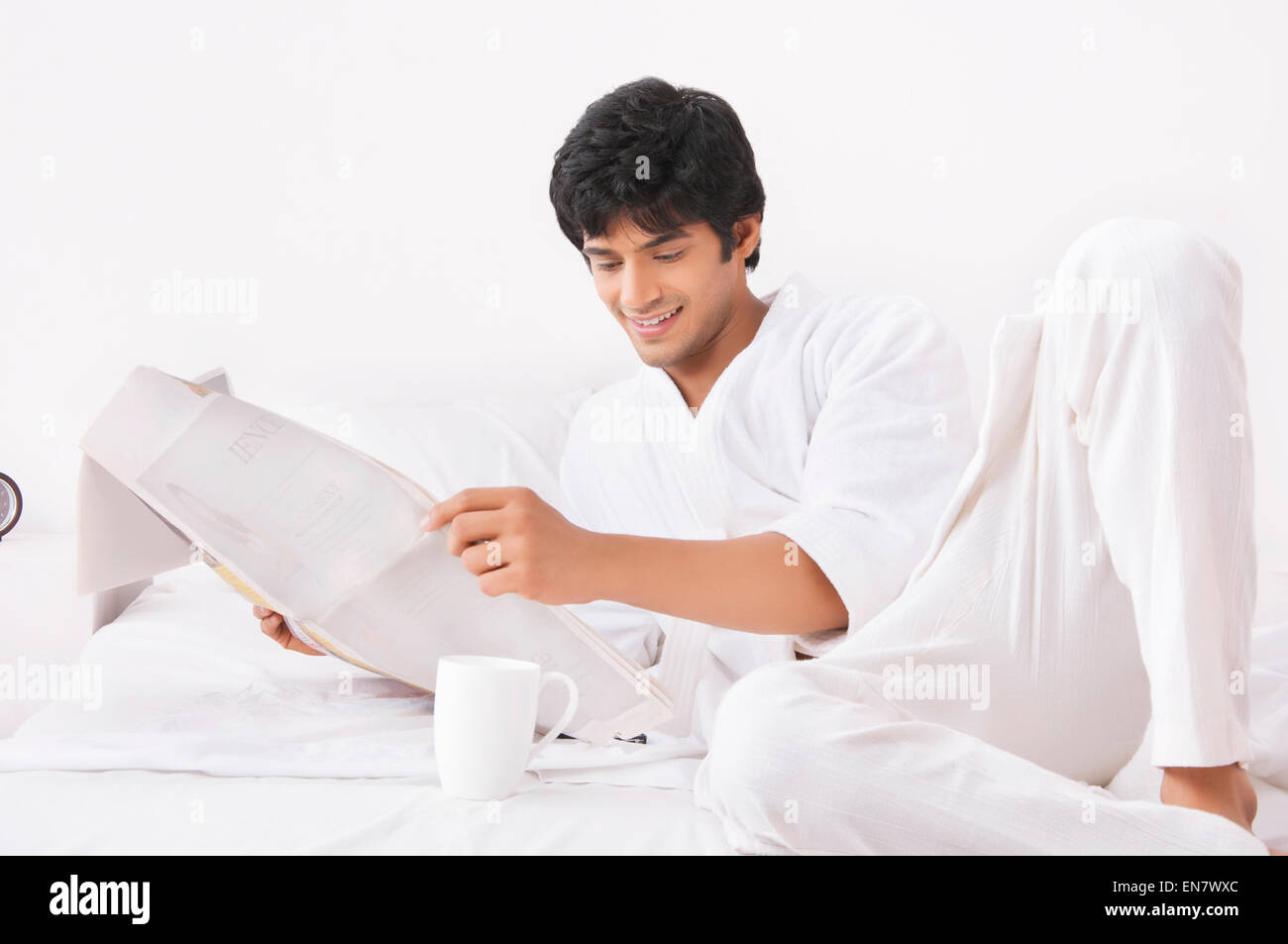Young man reading newspaper Stock Photo - Alamy Young man reading newspaper Stock Photo - Alamy