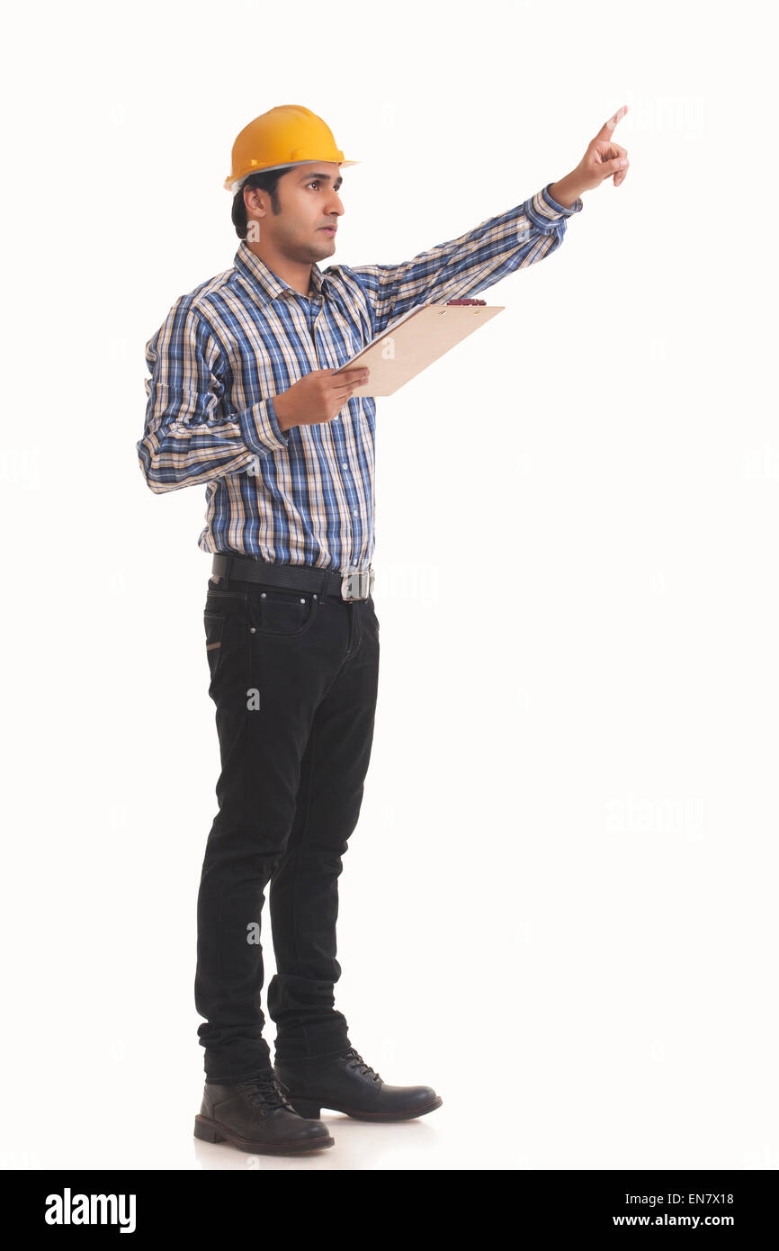 Contractor with Clipboard pointing Stock Photo - Alamy