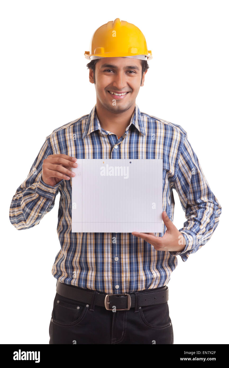 Portrait of smiling contractor holding placard Stock Photo - Alamy