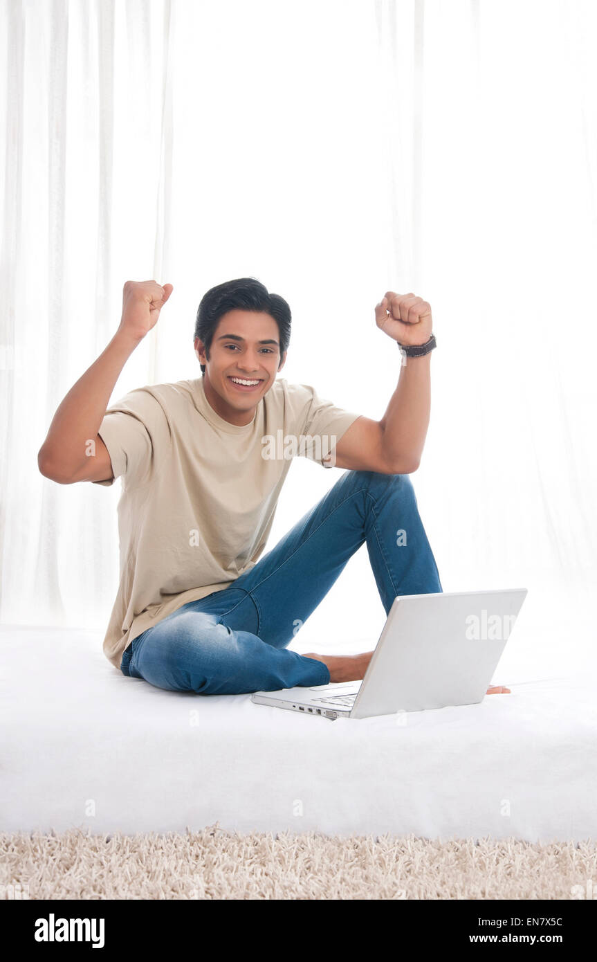 Portrait of young man rejoicing Stock Photo - Alamy