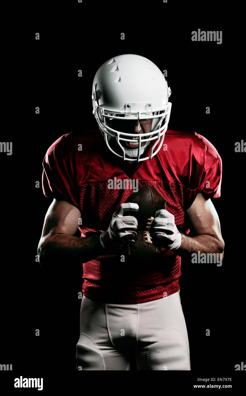 Football Player with number on a red uniform. Studio shot Stock Photo ...
