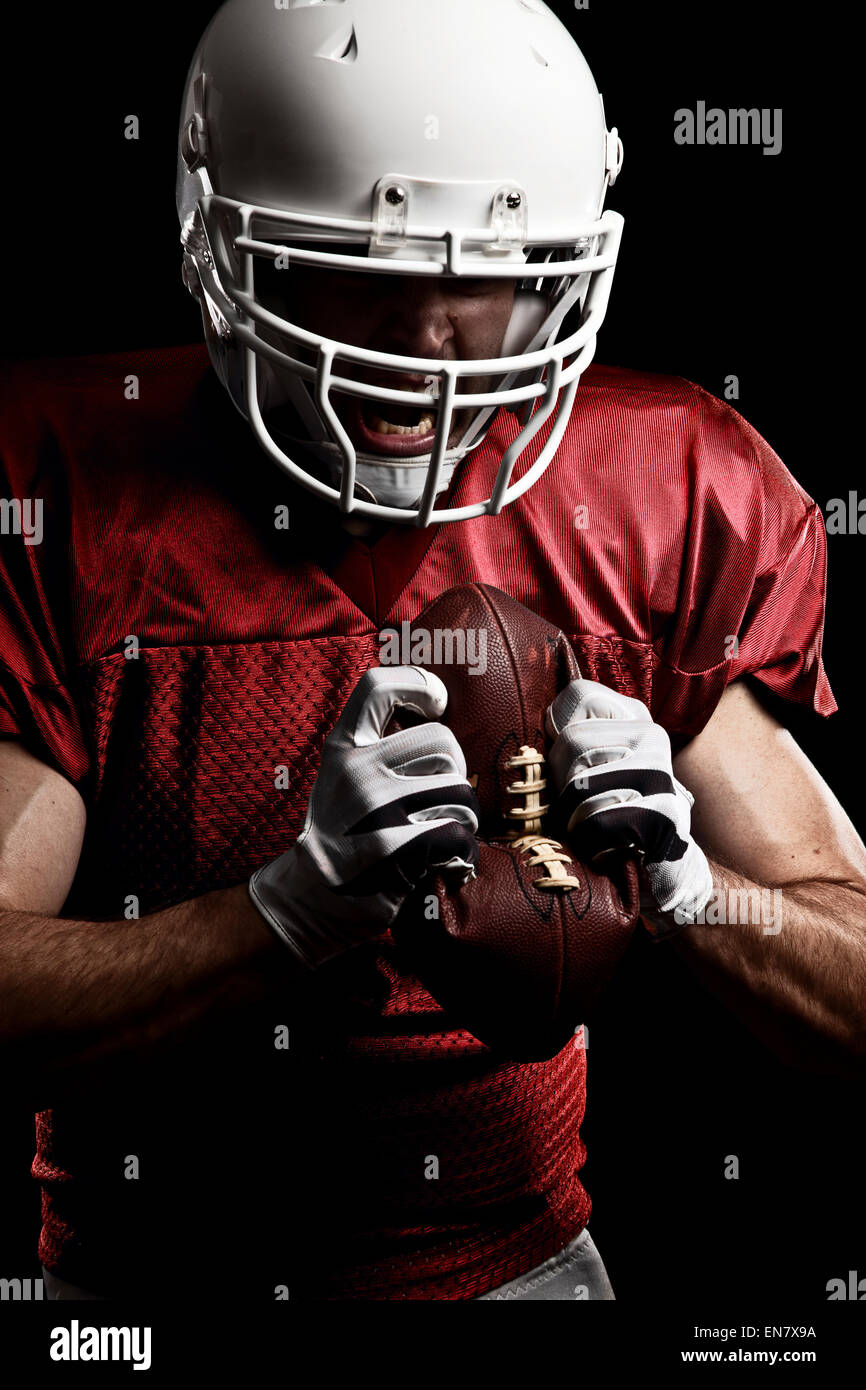 Football Player with number on a red uniform. Studio shot Stock Photo ...