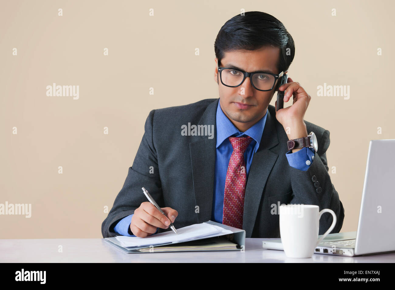 Businessman talking desk hi-res stock photography and images - Alamy