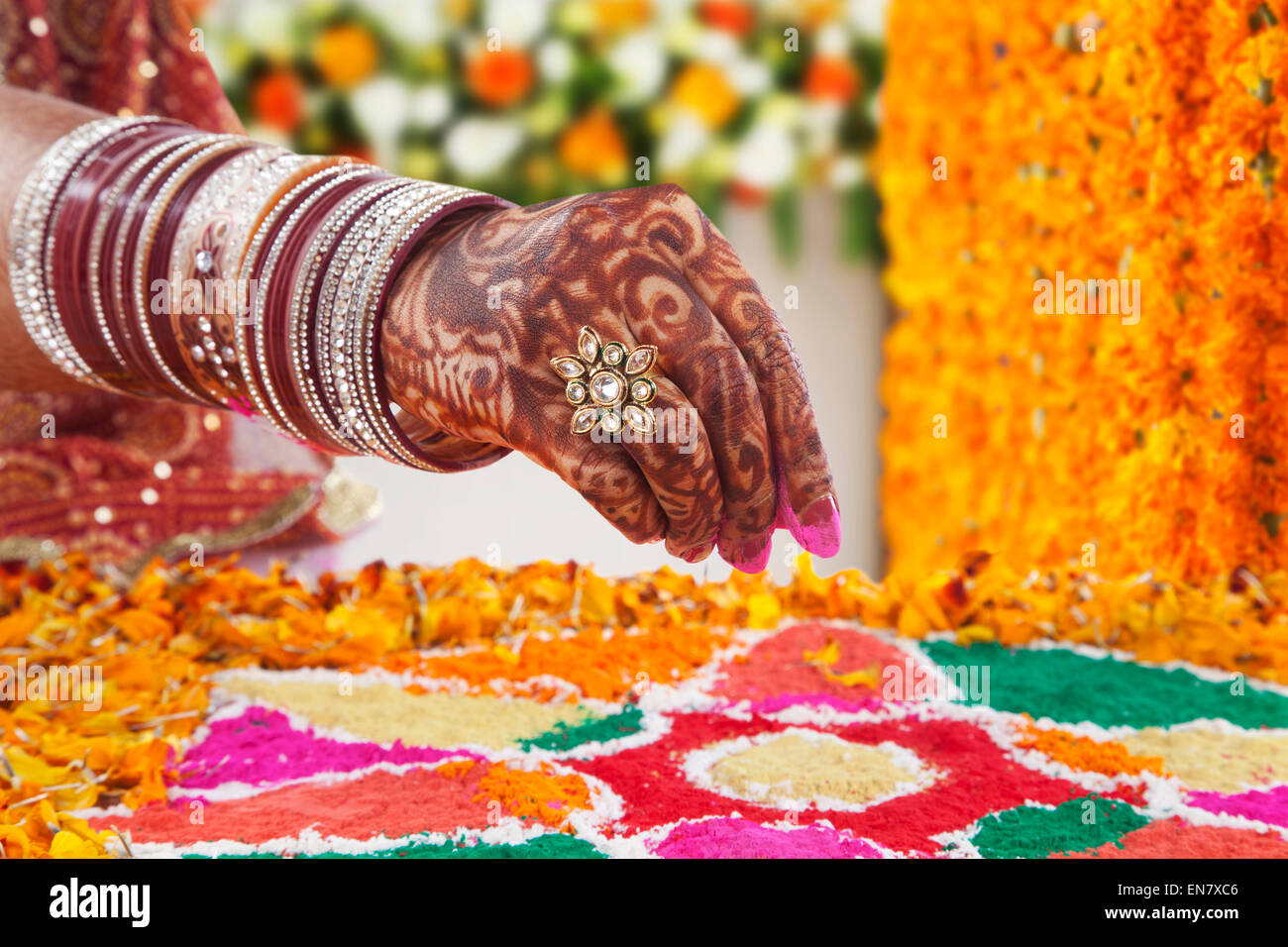 Close-up of a Brides hand making rangoli Stock Photo - Alamy