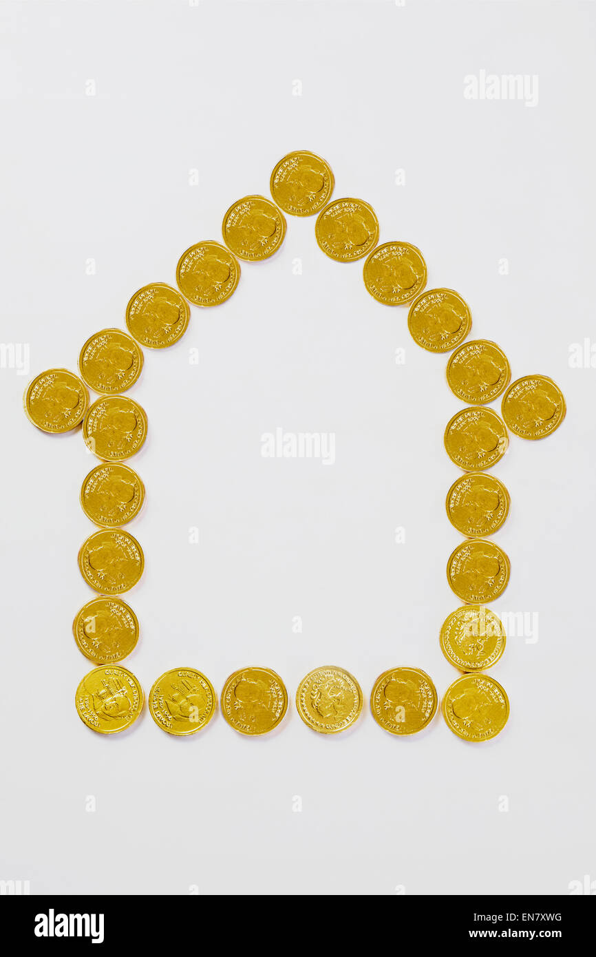 House of coins on white background Stock Photo - Alamy