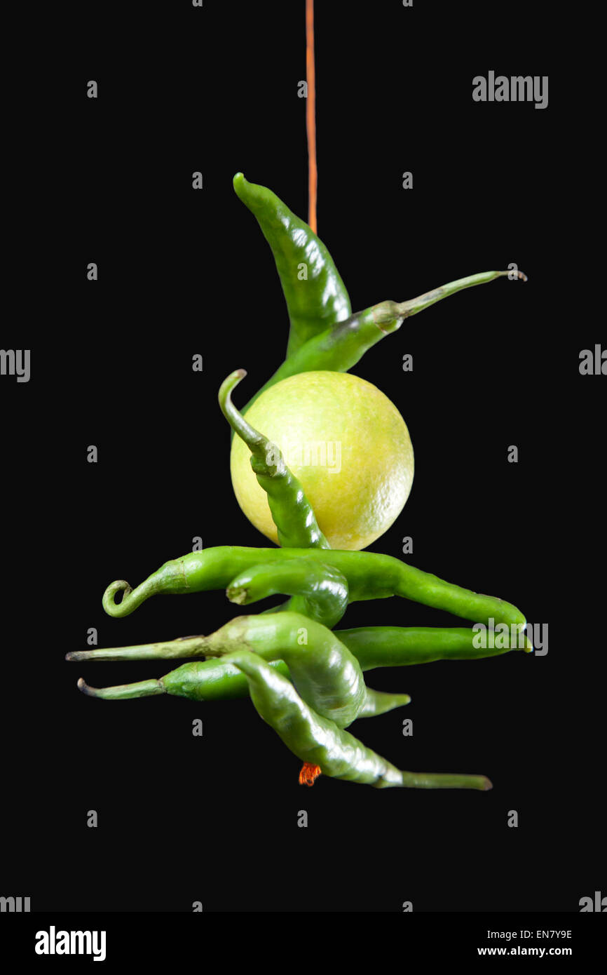 Indian Nimbu Mirchi charm isolated on black background Stock Photo - Alamy