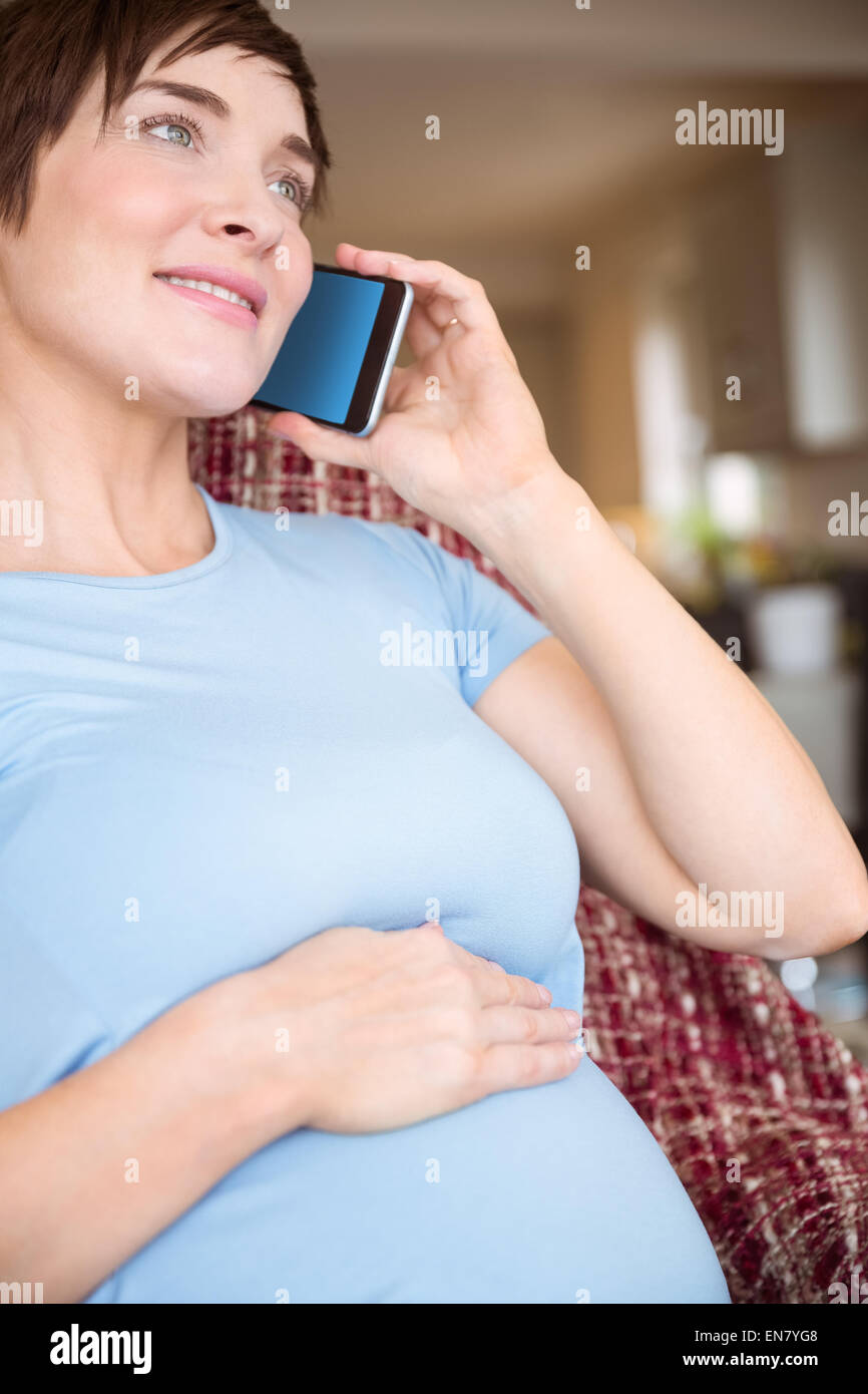 Pregnant woman making a call Stock Photo - Alamy