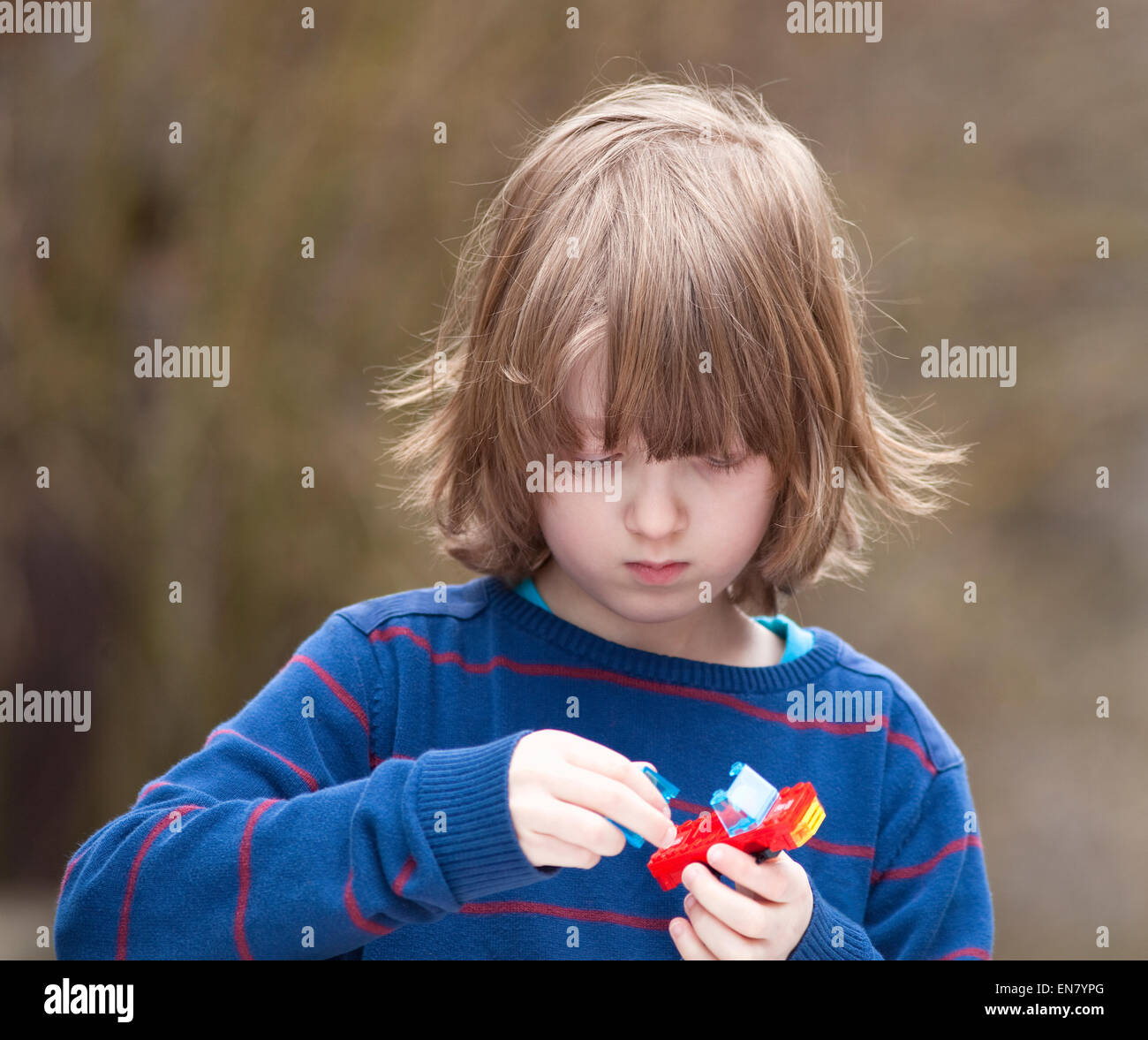 Child assembling toy hi-res stock photography and images - Alamy