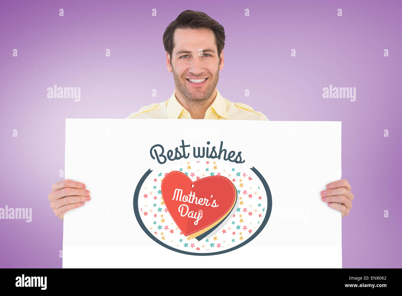 Composite image of attractive man smiling and holding poster Stock ...