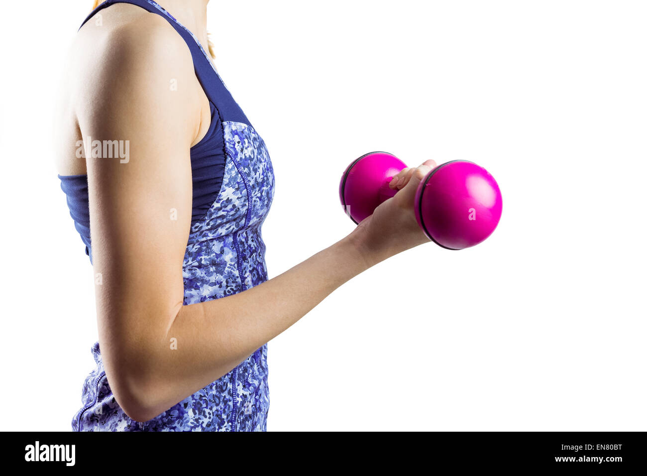 Fit woman lifting pink dumbbell Stock Photo - Alamy