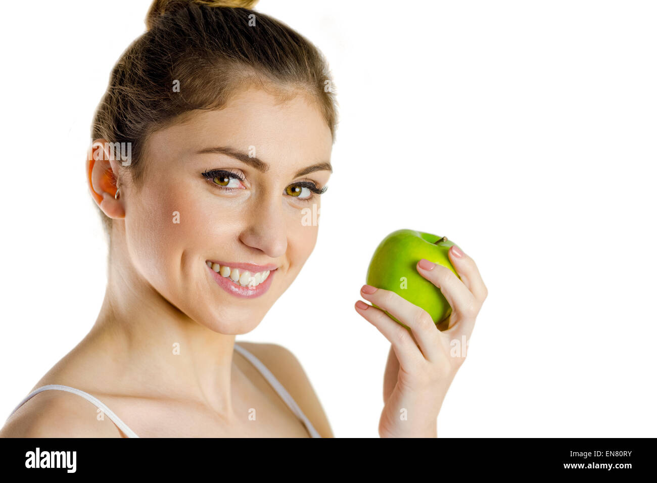 Slim woman holding green apple Stock Photo - Alamy