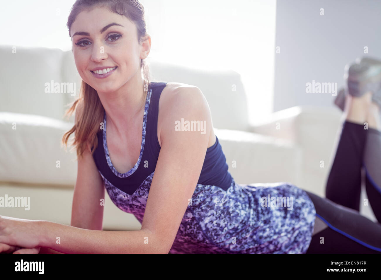 Fit woman lying on exercise mat Stock Photo - Alamy