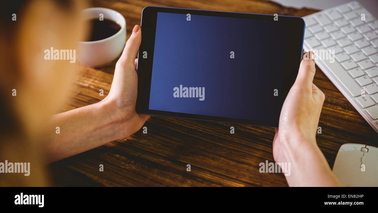 Woman using her tablet pc Stock Photo - Alamy