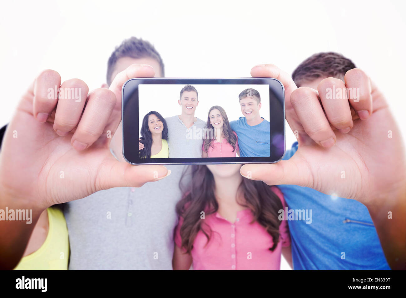 Composite image of hand holding smartphone showing Stock Photo - Alamy