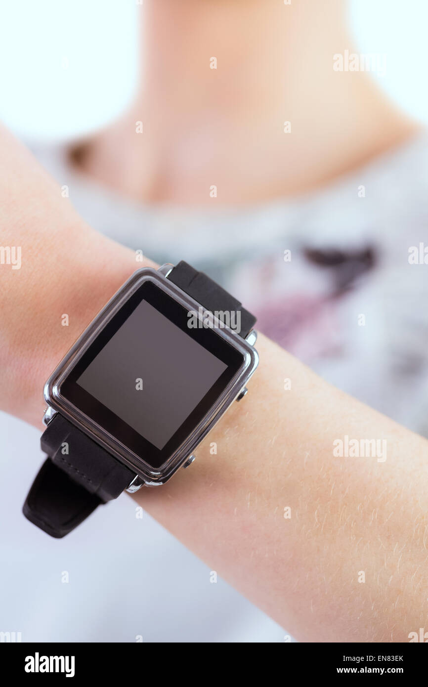 Woman wearing her smartwatch Stock Photo - Alamy
