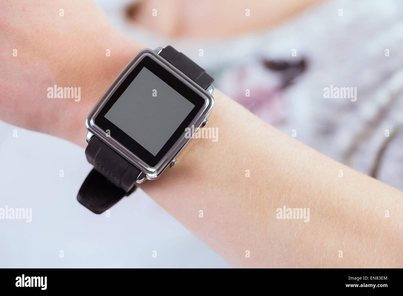Woman wearing her smartwatch Stock Photo - Alamy