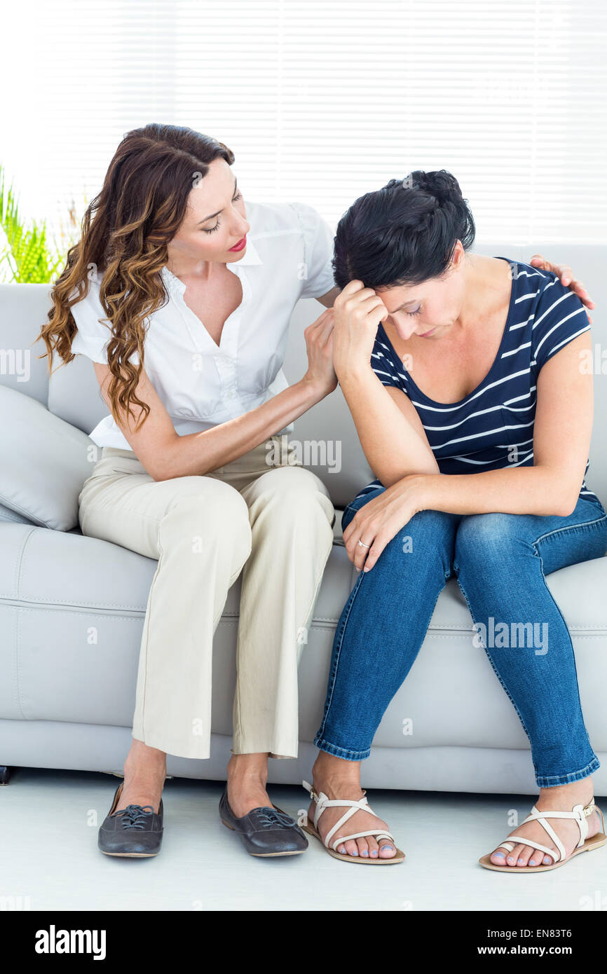 Therapist comforting her patient Stock Photo - Alamy