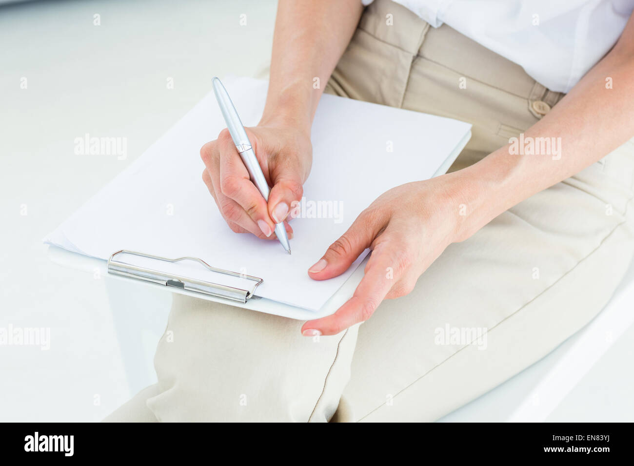 Therapist taking notes Stock Photo - Alamy