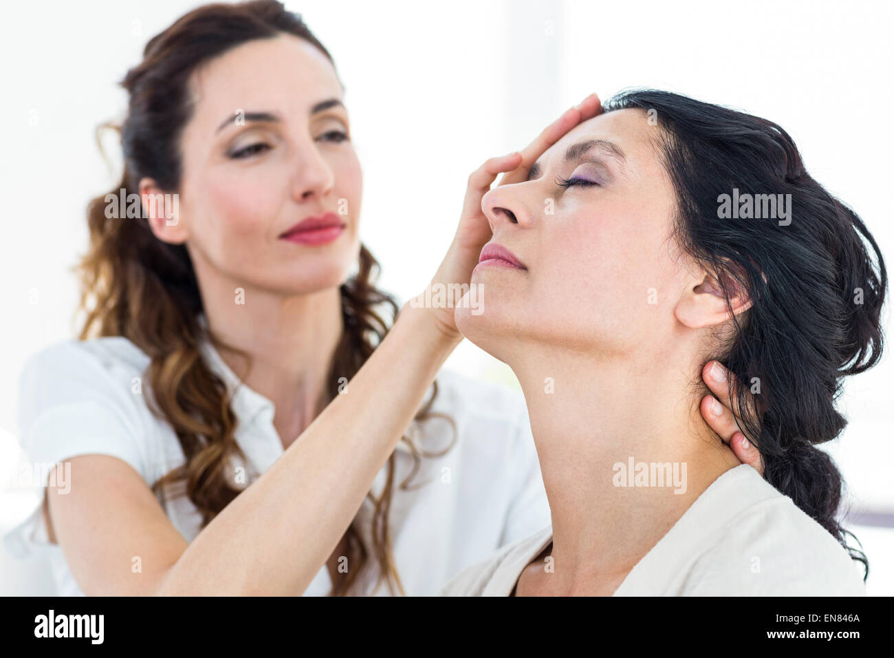 Therapist hypnotizing her patient Stock Photo - Alamy