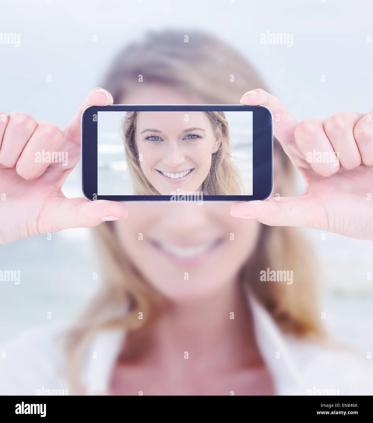 Composite image of hands holding smartphone Stock Photo - Alamy