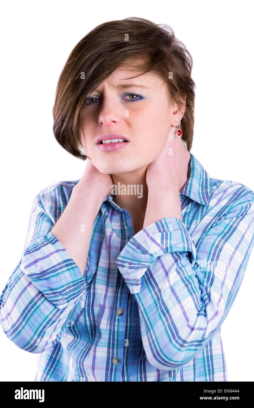 Pretty brunette with neck pain looking at camera Stock Photo - Alamy