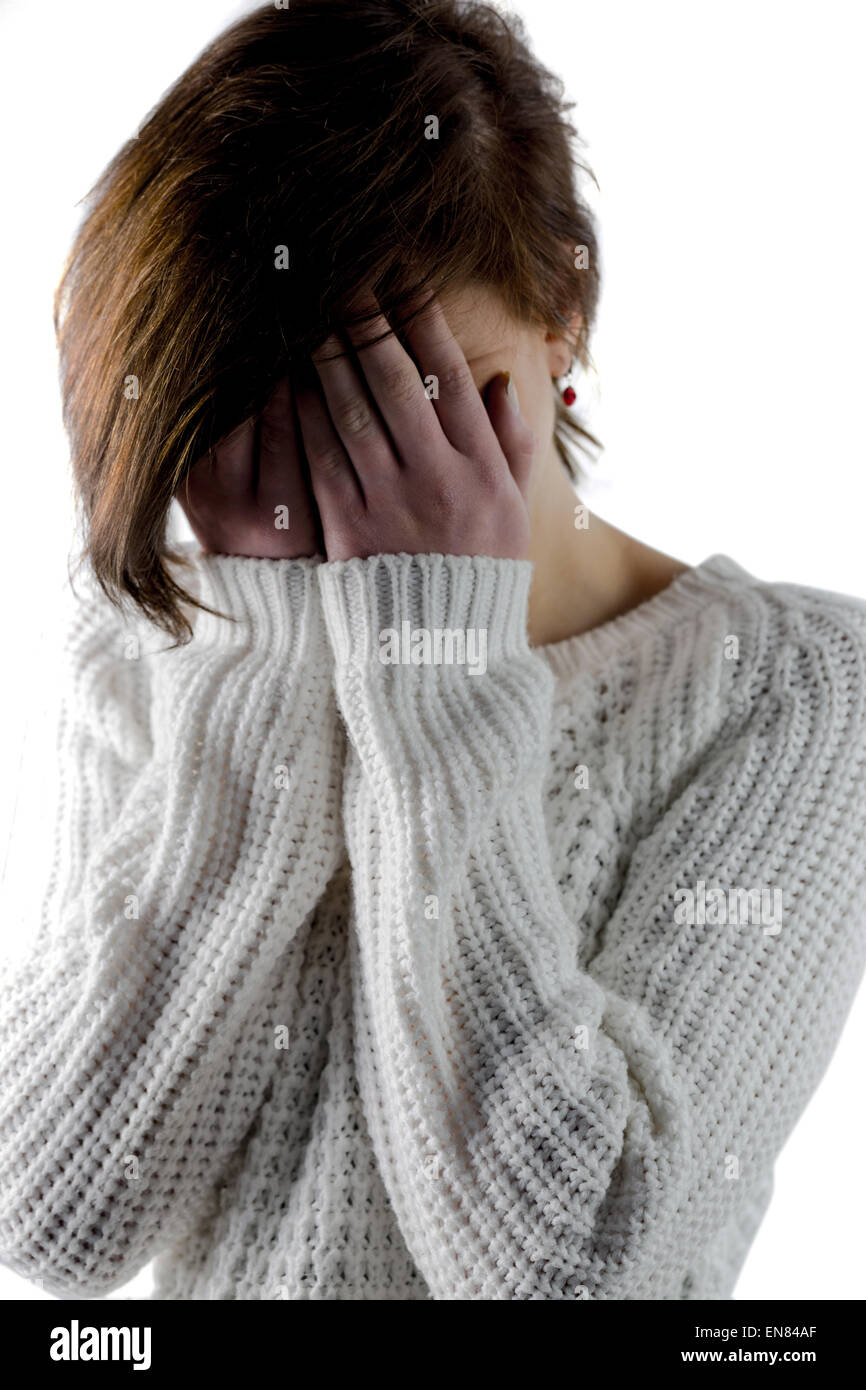 Sad pretty brunette crying with head on hands Stock Photo - Alamy