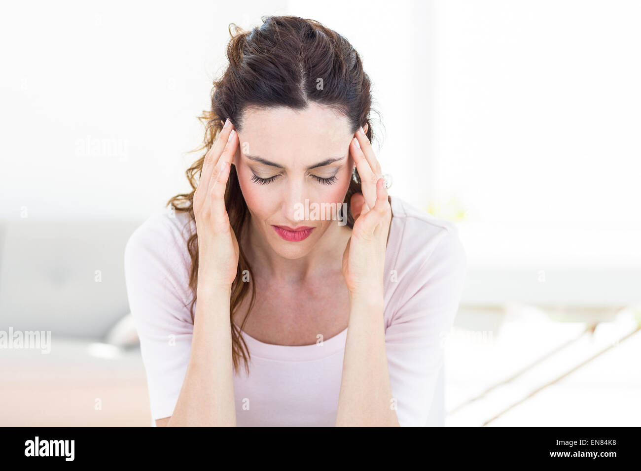 Woman having headache Stock Photo - Alamy
