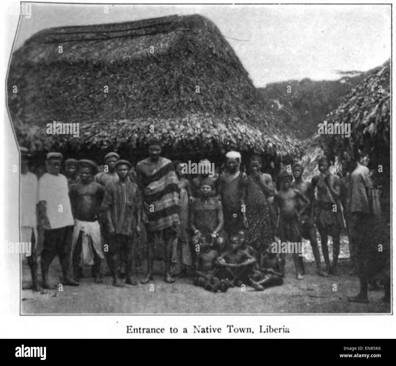This 1907 illustration depicts the entrance to a native town in Liberia ...