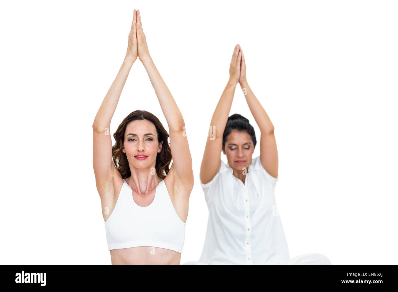 Relaxed women raising arms Stock Photo - Alamy