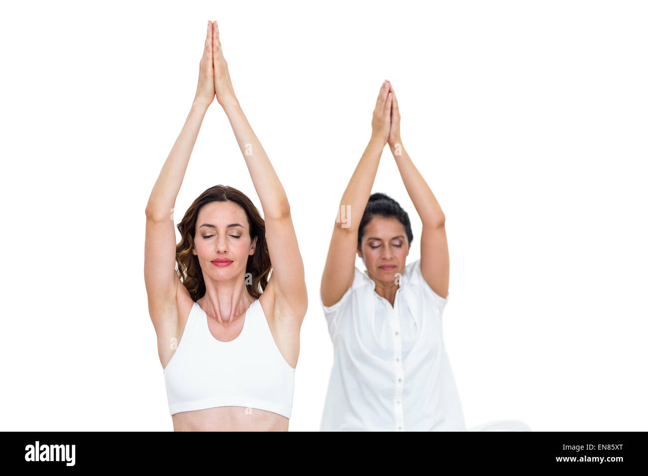 Relaxed women raising arms Stock Photo - Alamy