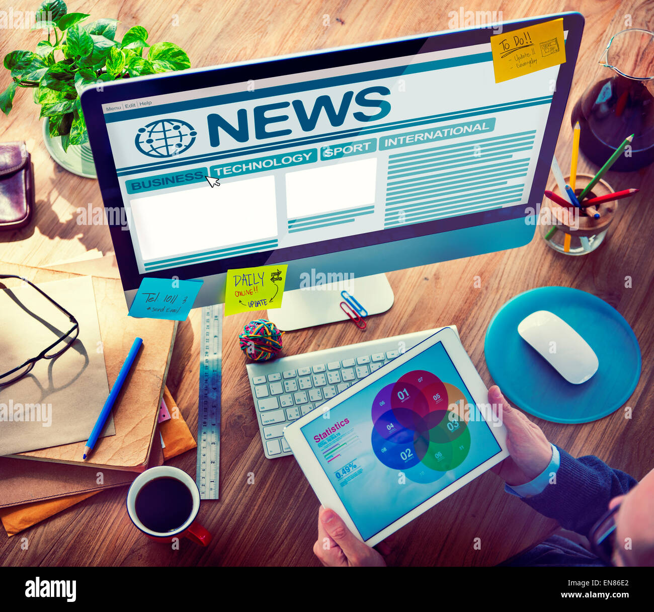 Man Browsing the Internet For the Latest News Stock Photo - Alamy