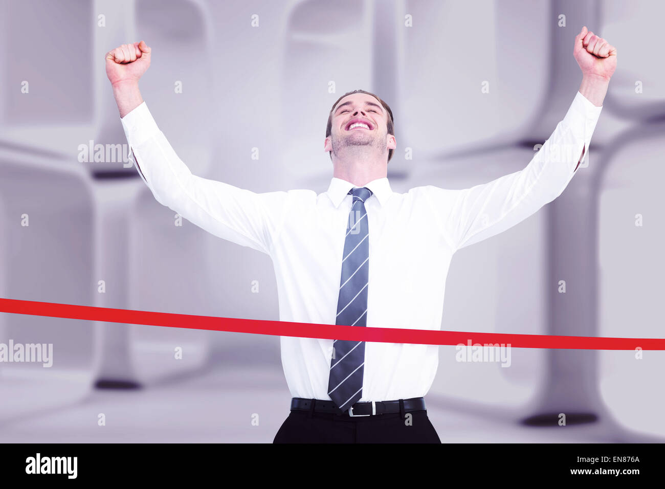 Composite image of happy businessman crossing the finish line Stock ...