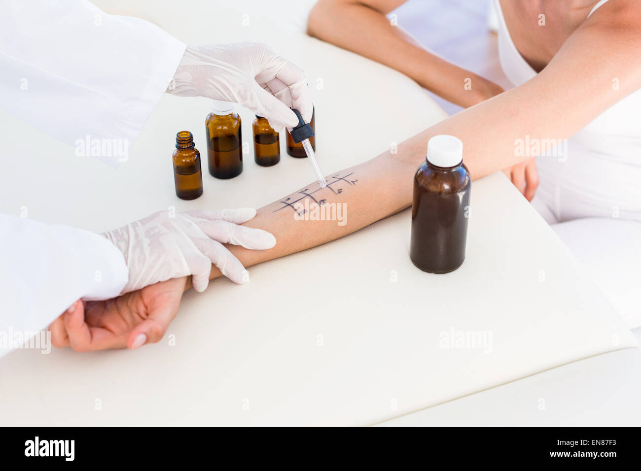 Doctor doing skin prick test at her patient Stock Photo - Alamy