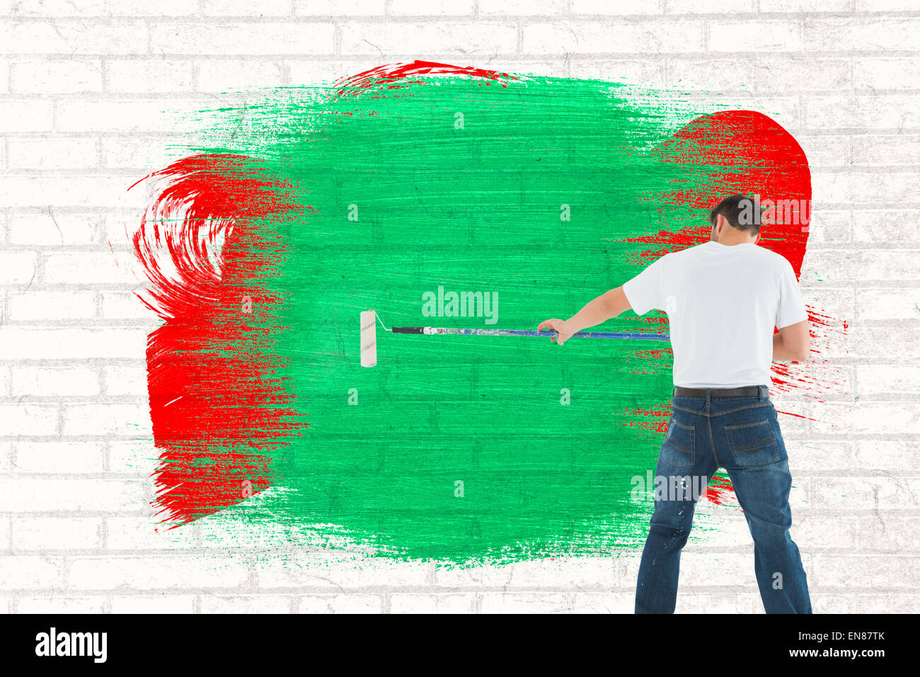 Composite image of man using paint roller on white background Stock ...