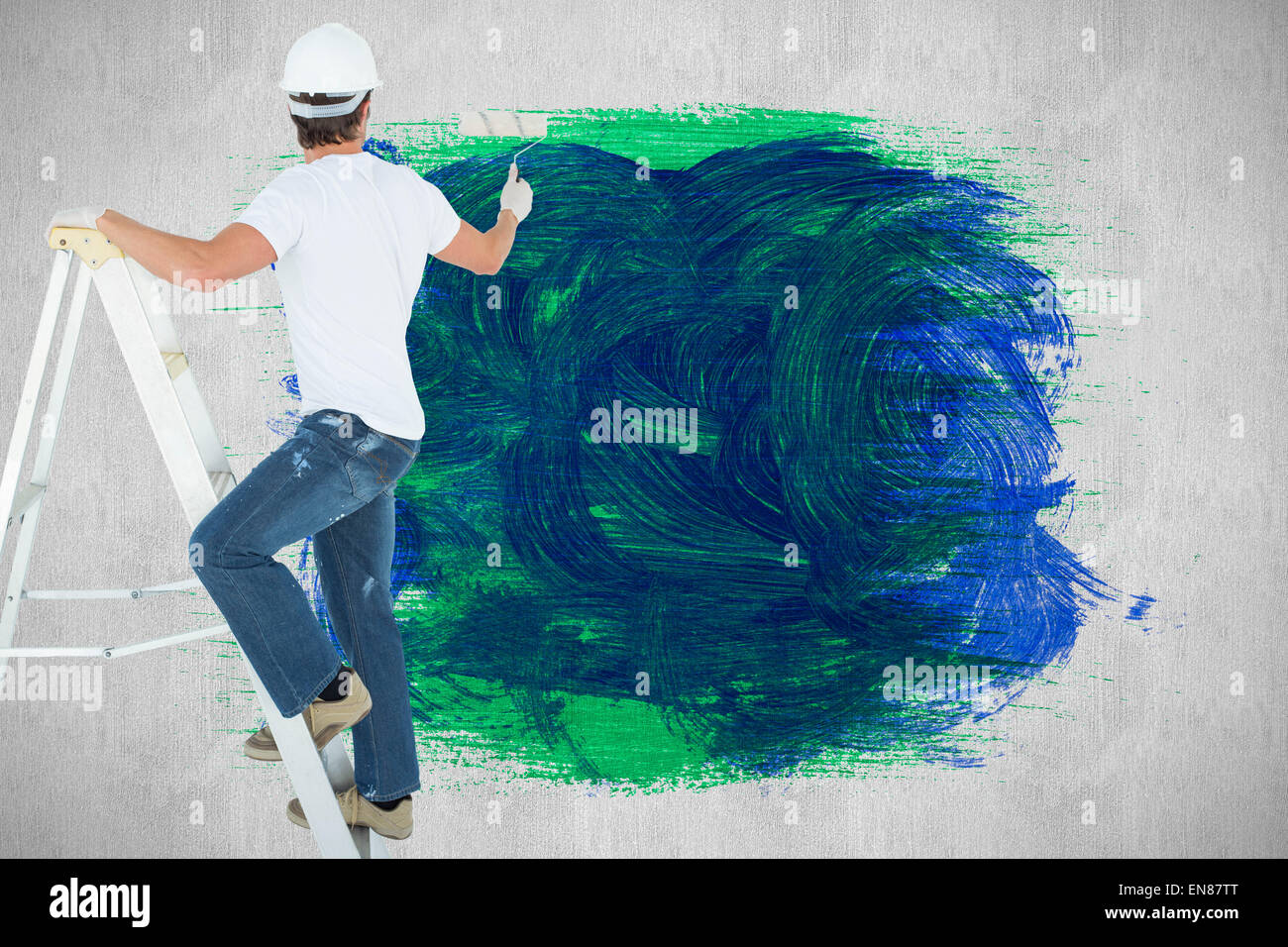 Composite image of man on ladder painting with roller Stock Photo - Alamy