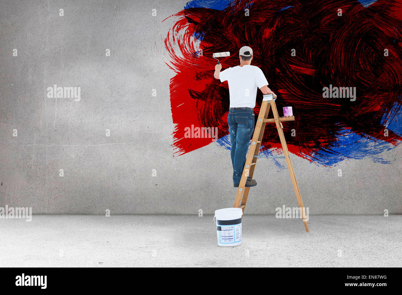 Composite image of man on ladder painting with roller Stock Photo - Alamy