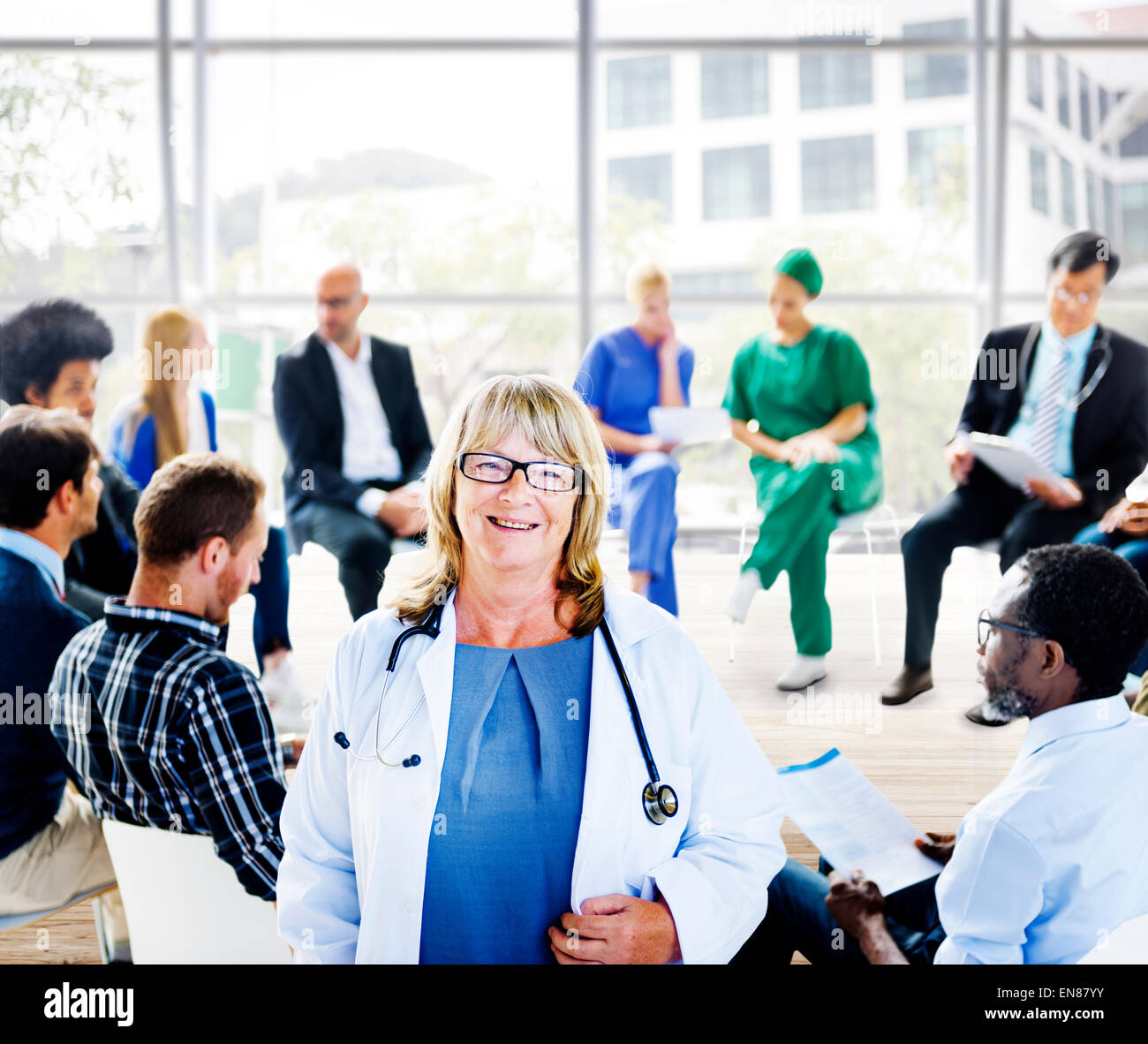 Female Doctor Standing in Front of a Support Group Stock Photo - Alamy