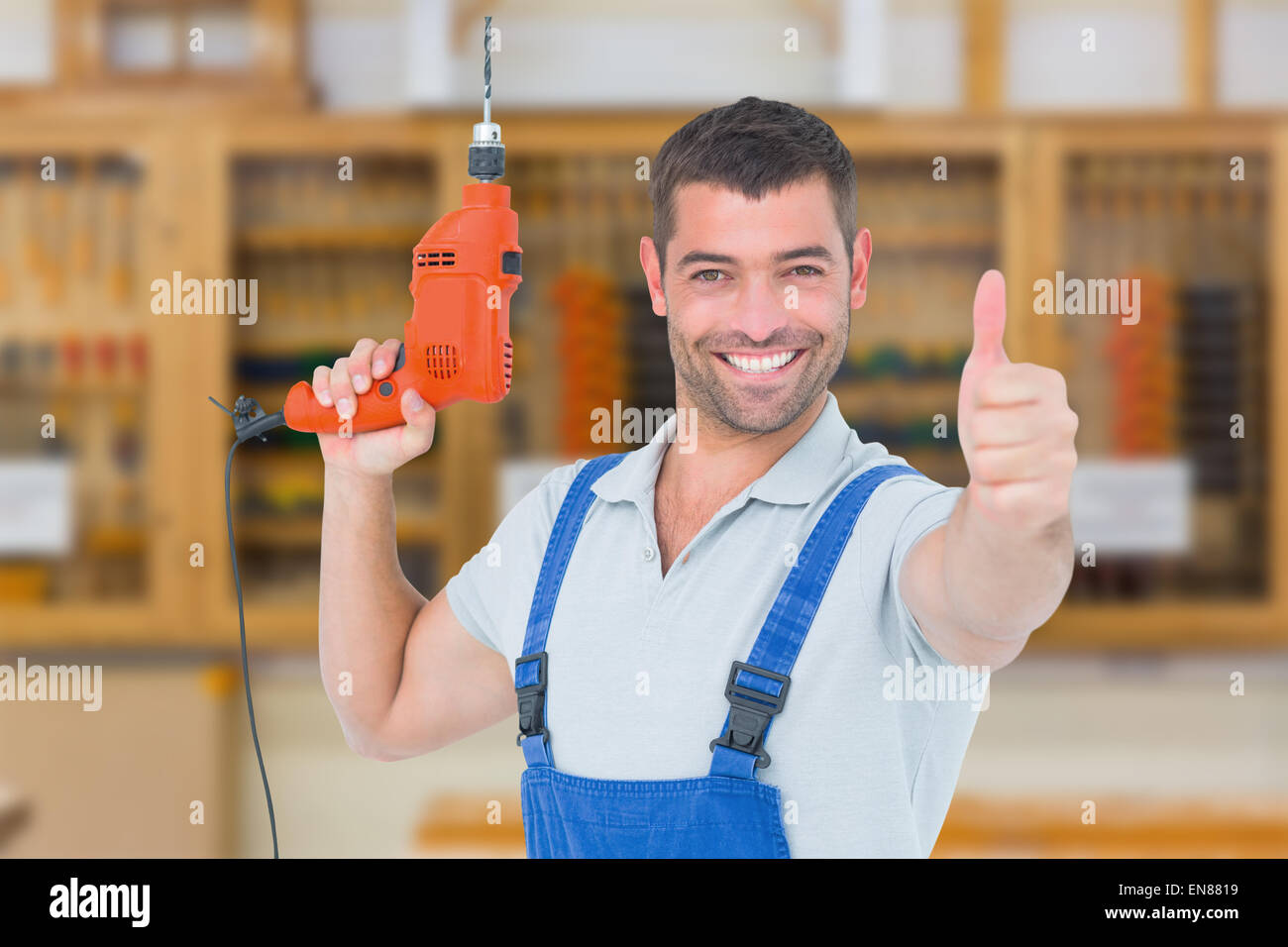Composite image of smiling repairman with drill machine gesturing ...