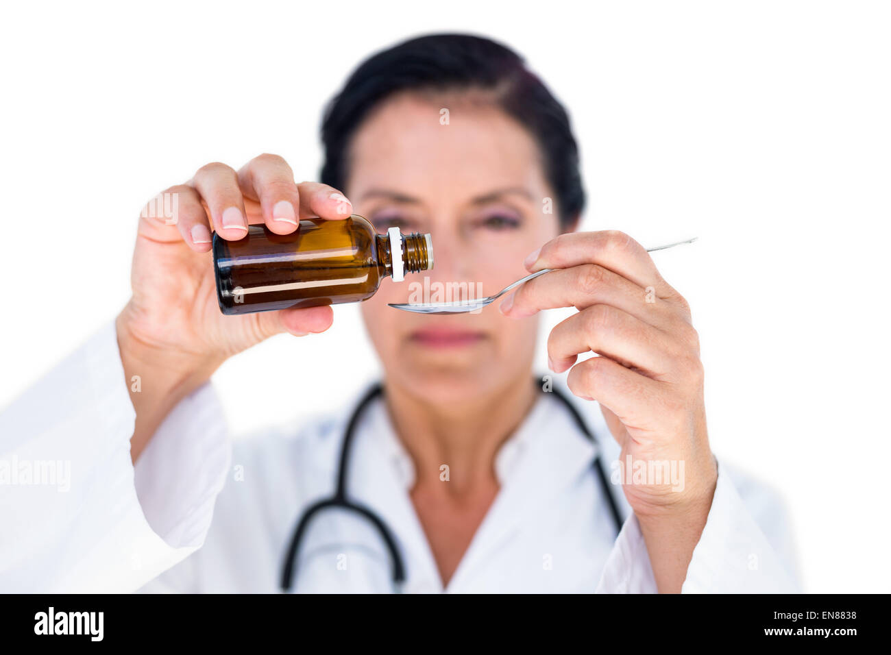 Doctor pouring syrup in spoon hi-res stock photography and images - Alamy