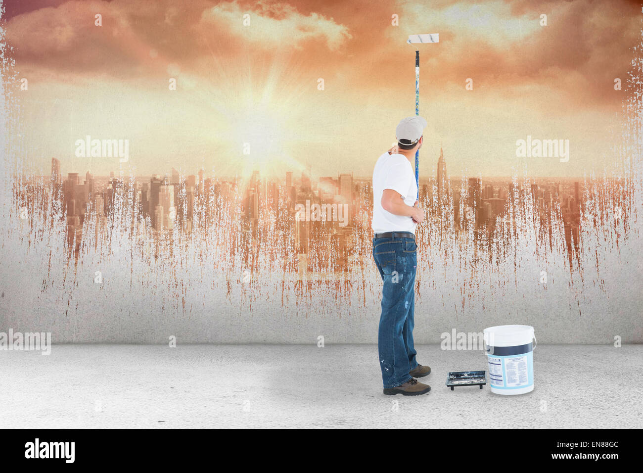 Composite image of man using paint roller on white background Stock ...