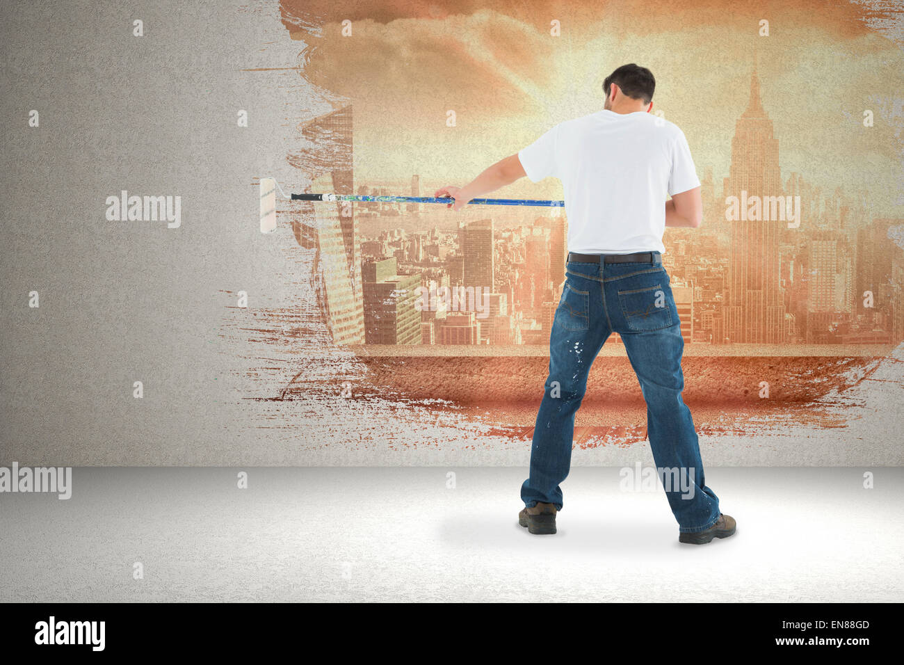 Composite image of man using paint roller on white background Stock ...